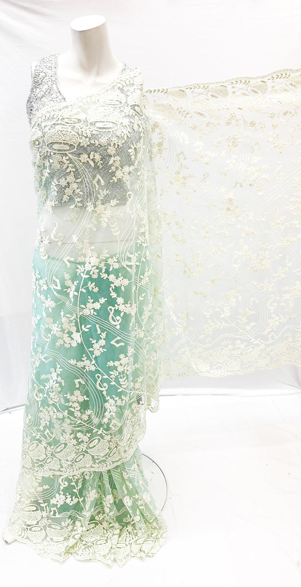 Pastel sea foam colour heavy embroidered netting jaal saree with silve ...