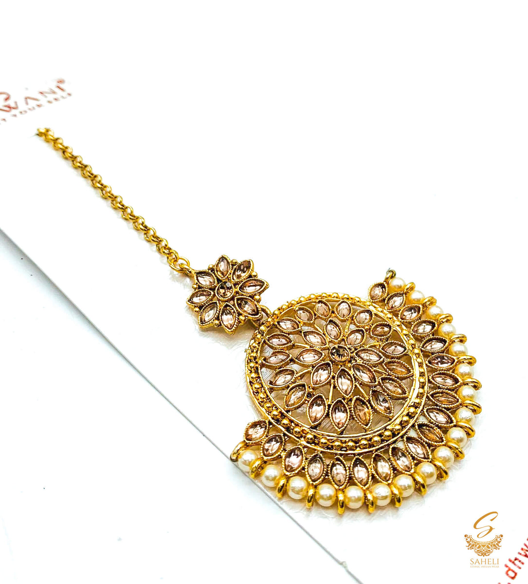 golden colour pearls with golden stone beautiful tikka– Saheli Ethnic ...