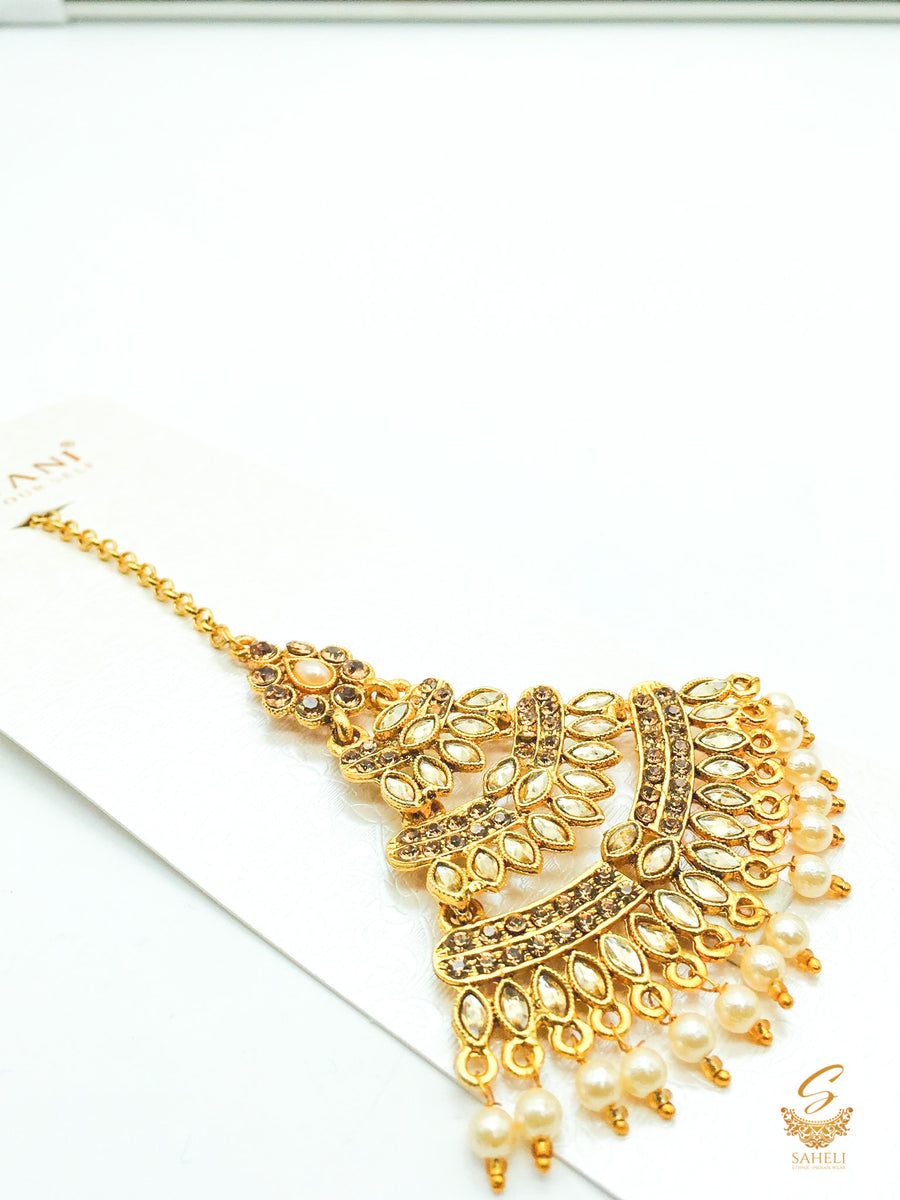 Golden Pearls & Stone Beautiful Tikka– Saheli Ethnic Indian Wear